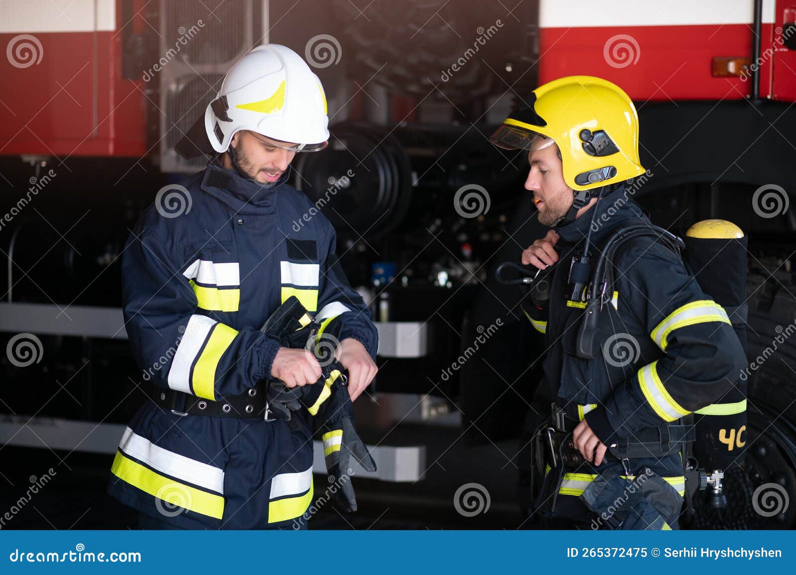 Portrait of Two Heroic Fireman in Protective Suit and Helmet. Stock ...
