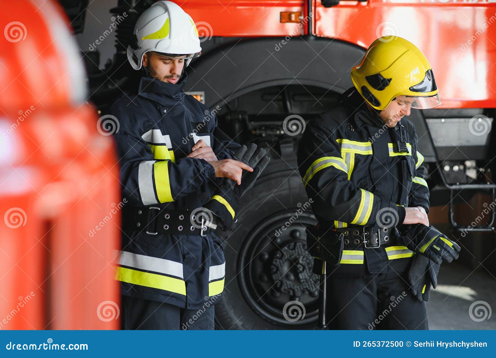 Portrait of Two Heroic Fireman in Protective Suit and Helmet. Stock ...
