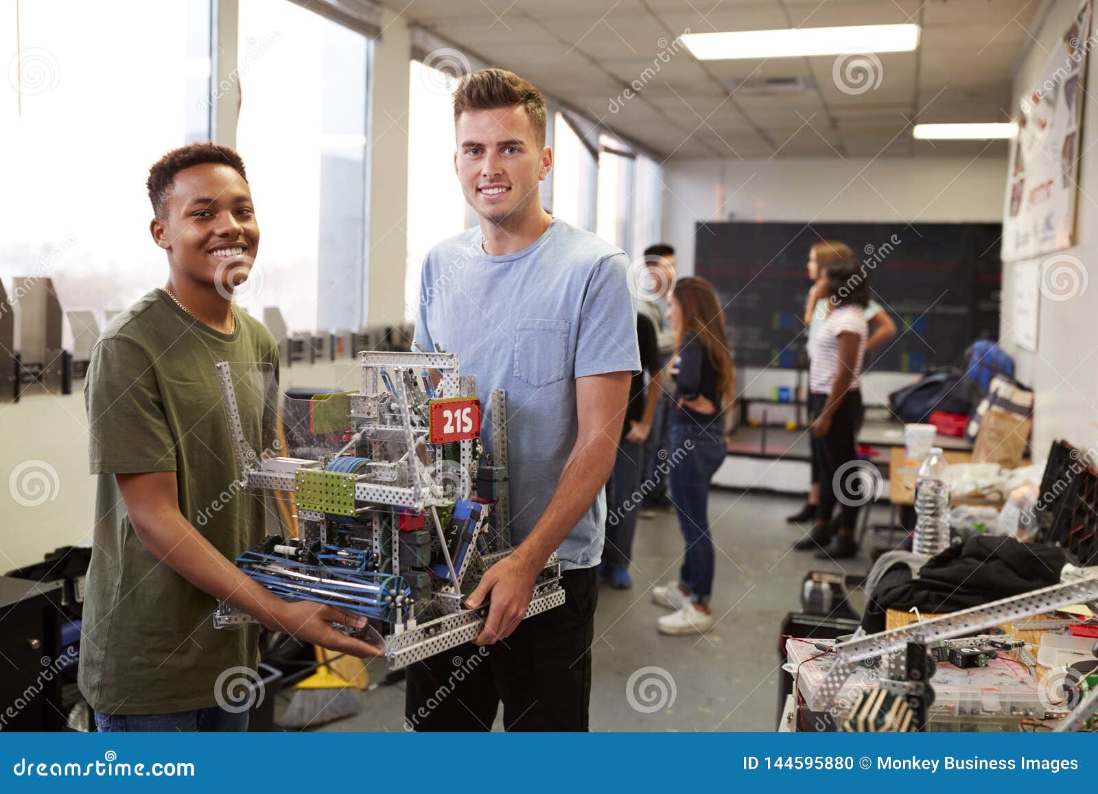 Portrait of Two Male University Students Carrying Machine in Science ...