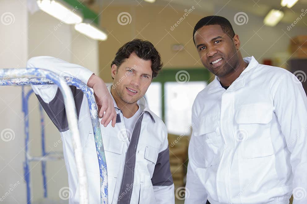 Portrait Two Men Decorating Team Stock Photo - Image of teamwork ...