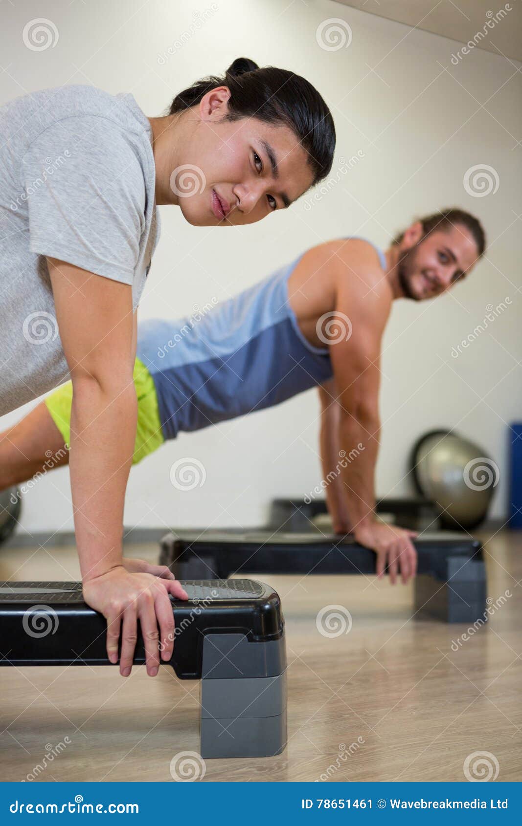 Portrait of Two Men Doing Aerobic Exercise on Stepper Stock Image ...