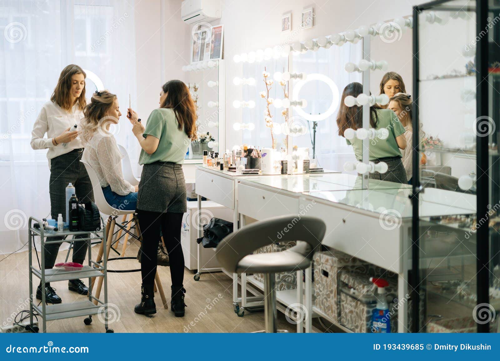 Portrait of Two Professional Make-up Artist Doing Makeover in Lighting ...