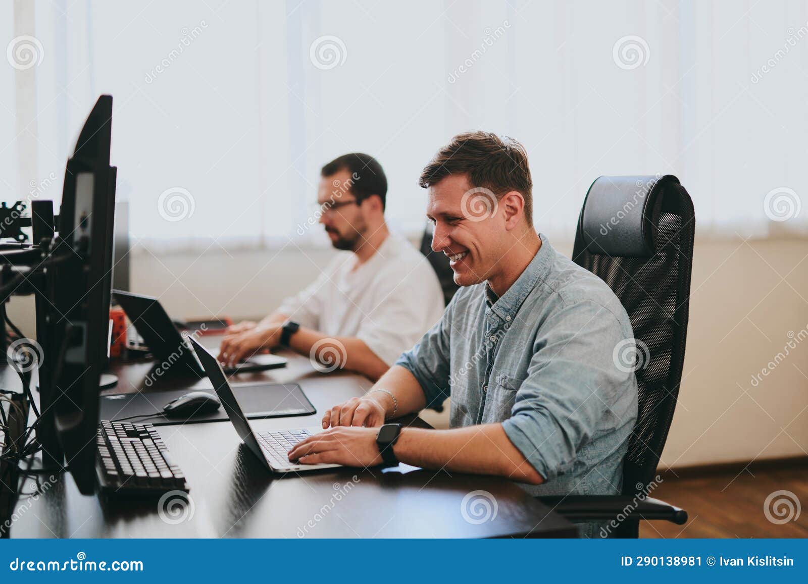 Portrait of Two Professional Male Programmers Working on Computer in ... Portrait of Two Professional Male Programmers Working on Computer in ...