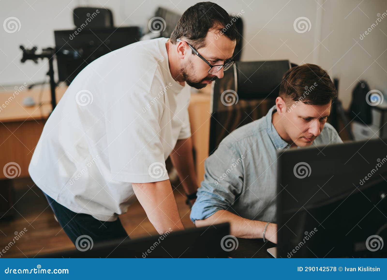Portrait of Two Professional Male Programmers Working on Computer in ... Portrait of Two Professional Male Programmers Working on Computer in ...
