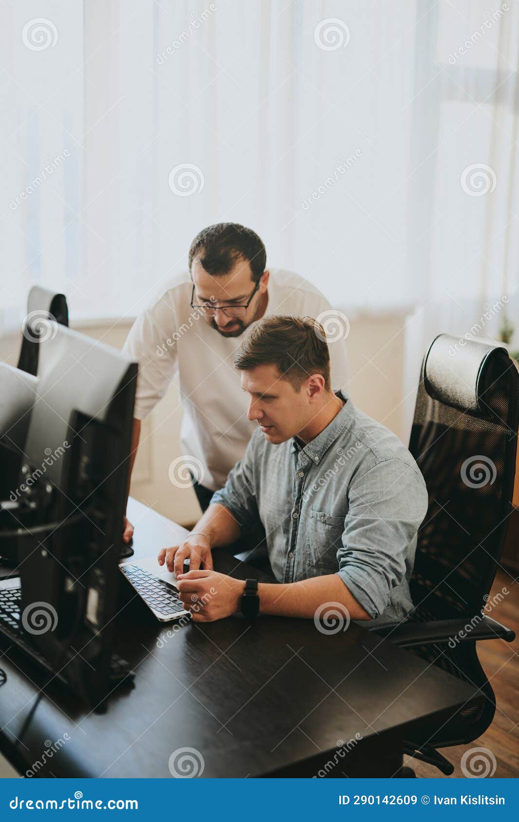 Portrait of Two Professional Male Programmers Working on Computer in ... Portrait of Two Professional Male Programmers Working on Computer in ...