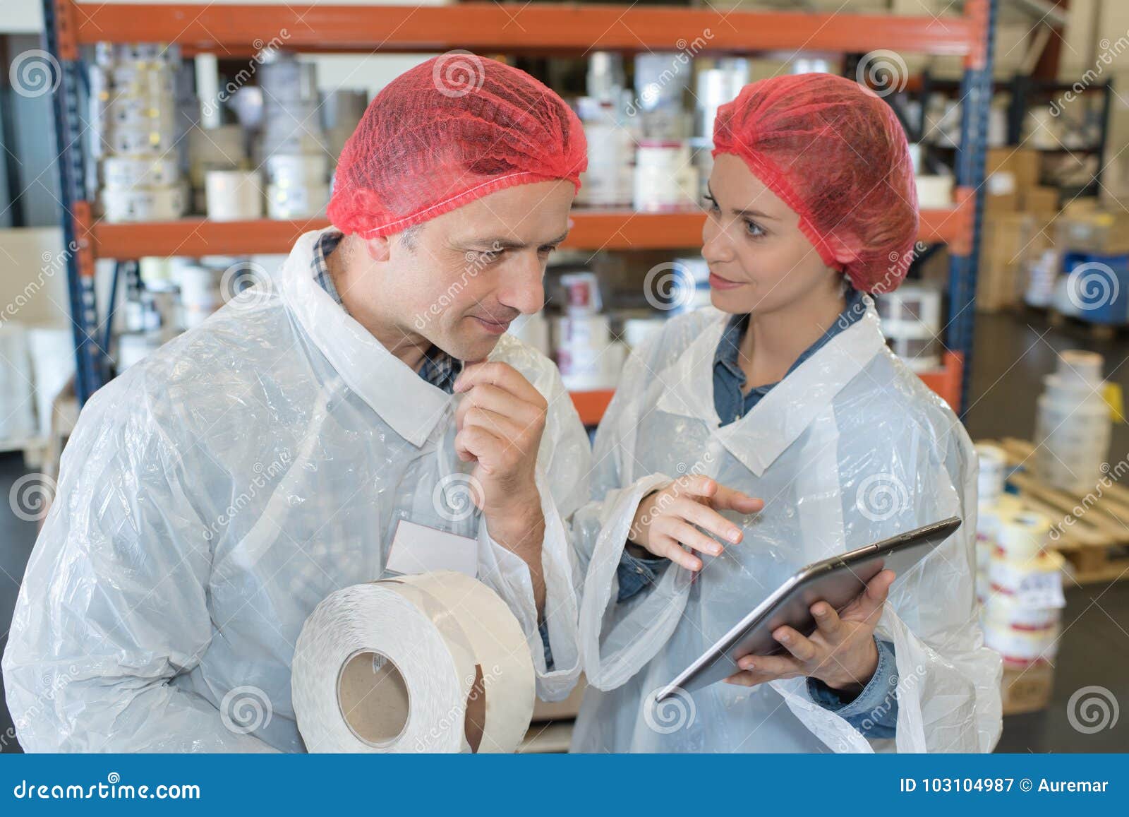 Two Workers In Lab Coats Showing Their Dairy Production Process Stock ...