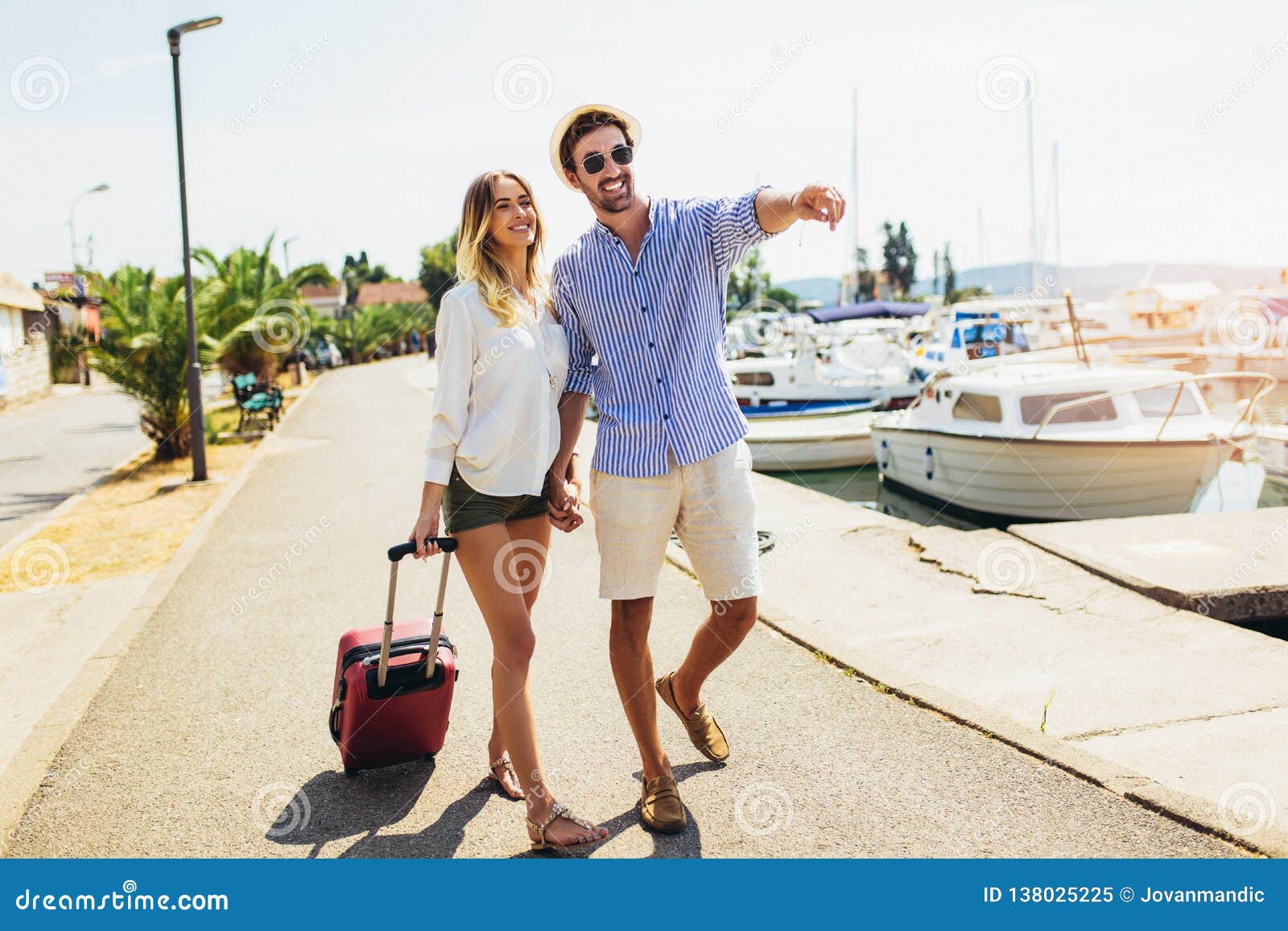 Two Smiling Young Tourists Walking with Suitcase Stock Image - Image of ...