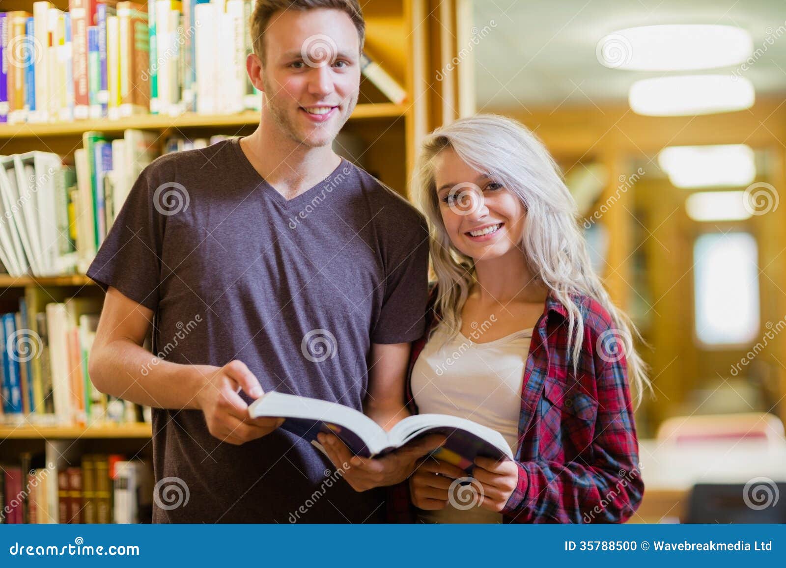 Portrait of Two Students Reading Book in the Library Stock Photo ...