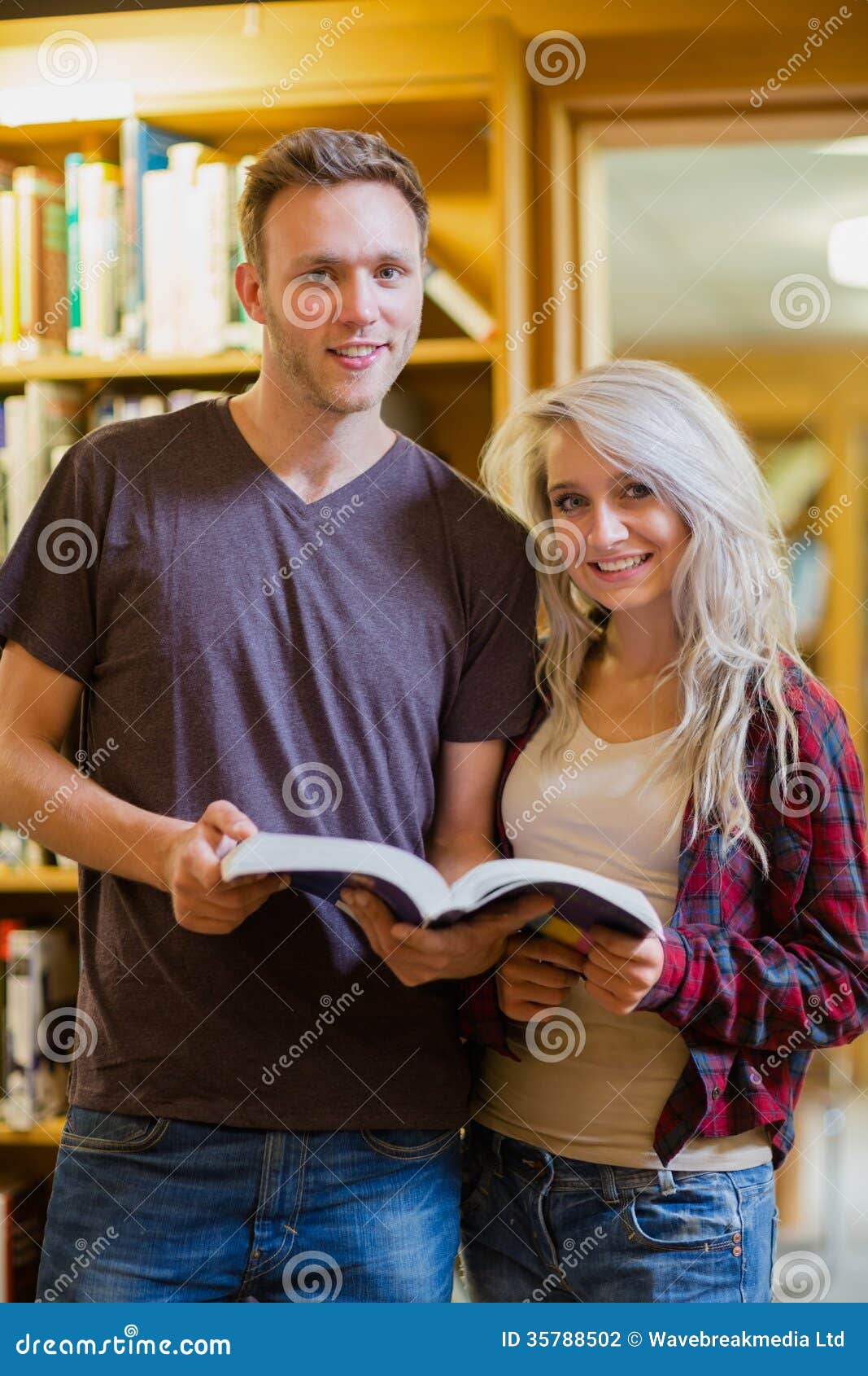 Portrait of Two Students Reading Book in the Library Stock Photo ...
