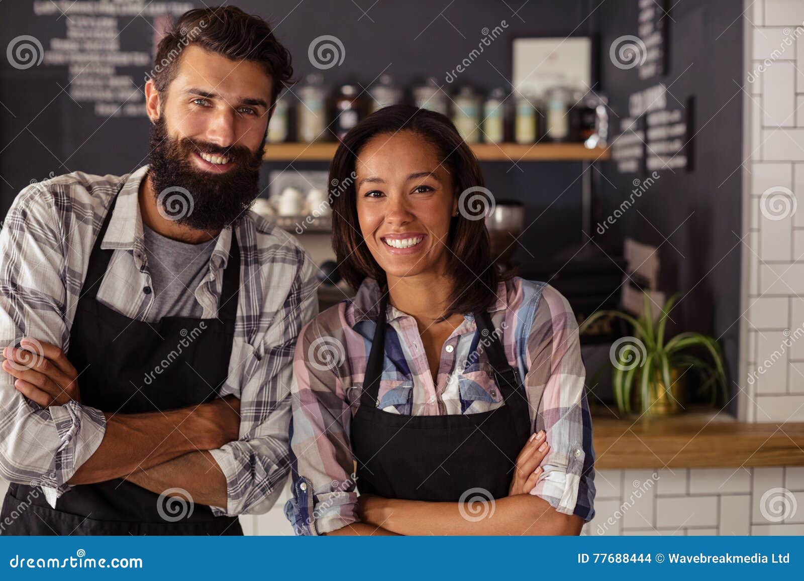 Portrait of two waiters stock photo. Image of mixedrace - 77688444