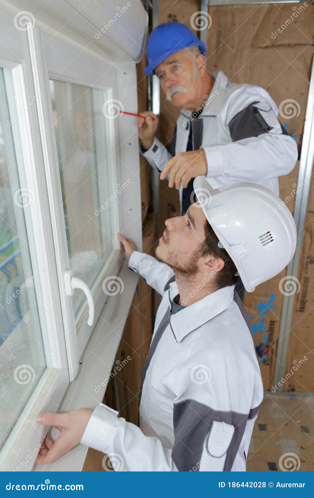 Portrait Two Workmen Fitting Window Stock Photo - Image of twopeople ...