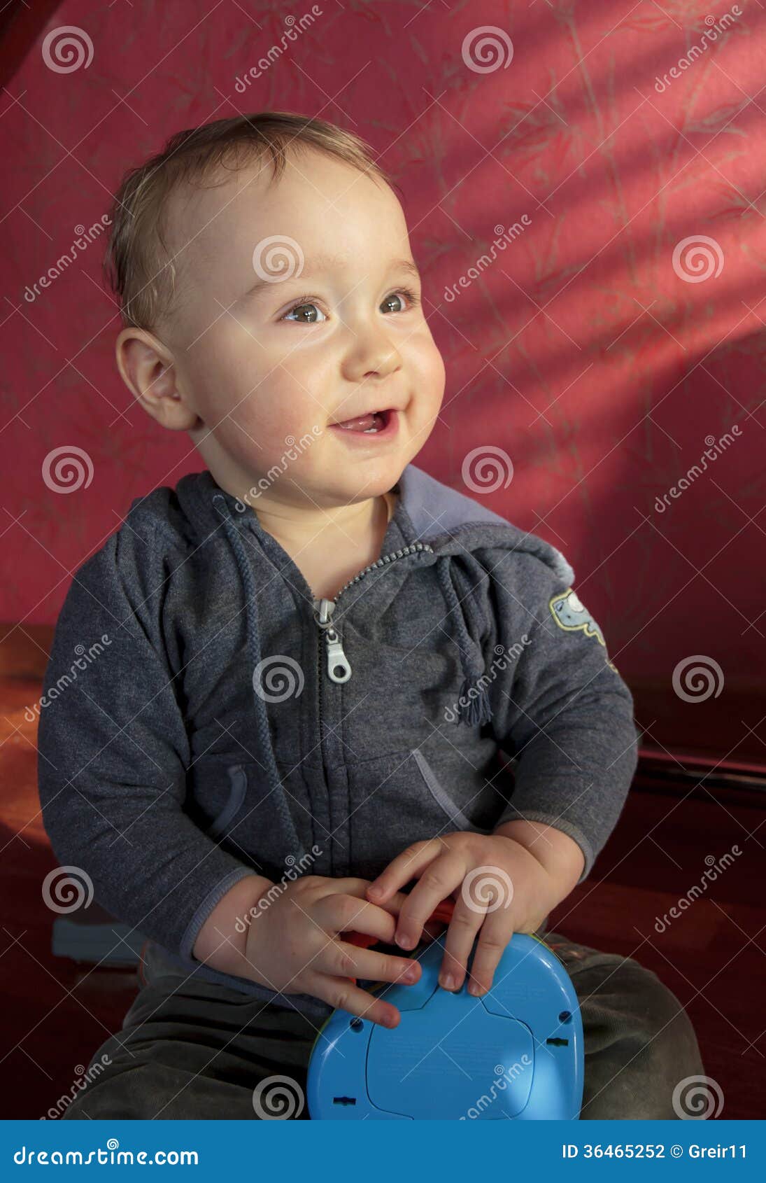 Portrait of a Two Years Old Boy Sitting on the Floor and Smiling Stock ...