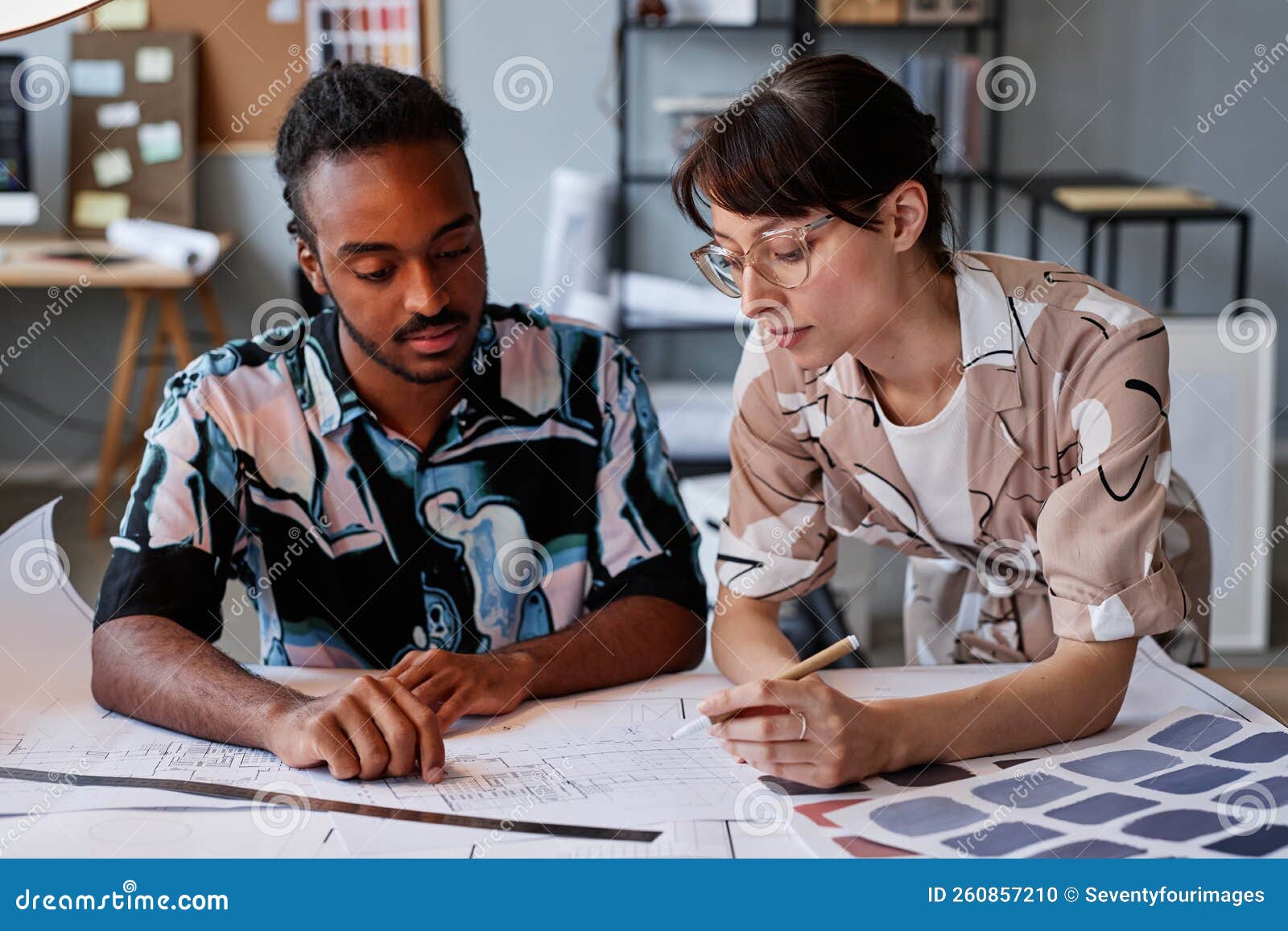 Architects Working on Floor Plans for Interior Design Stock Photo ...