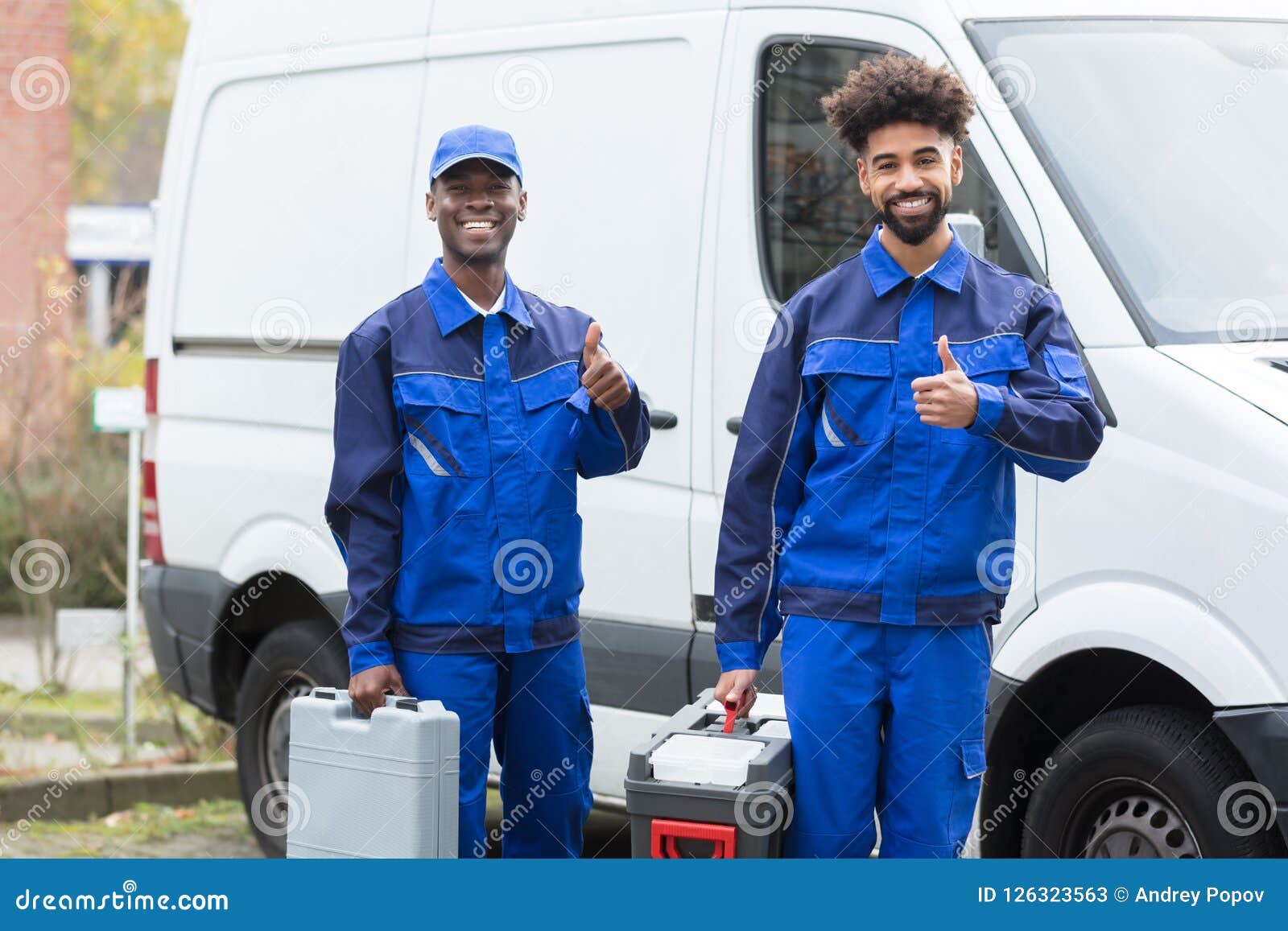 Portrait of Two Young Manual Worker with Their Tool Boxes Stock Image ...