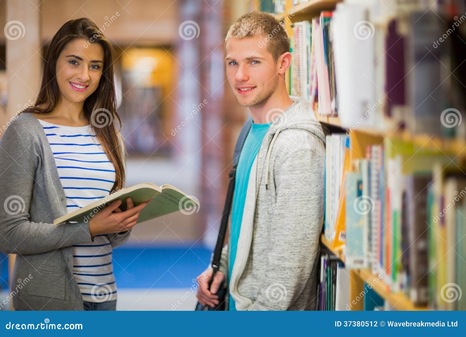 Students Standing by Bookshelf in the Library Stock Photo - Image of ...