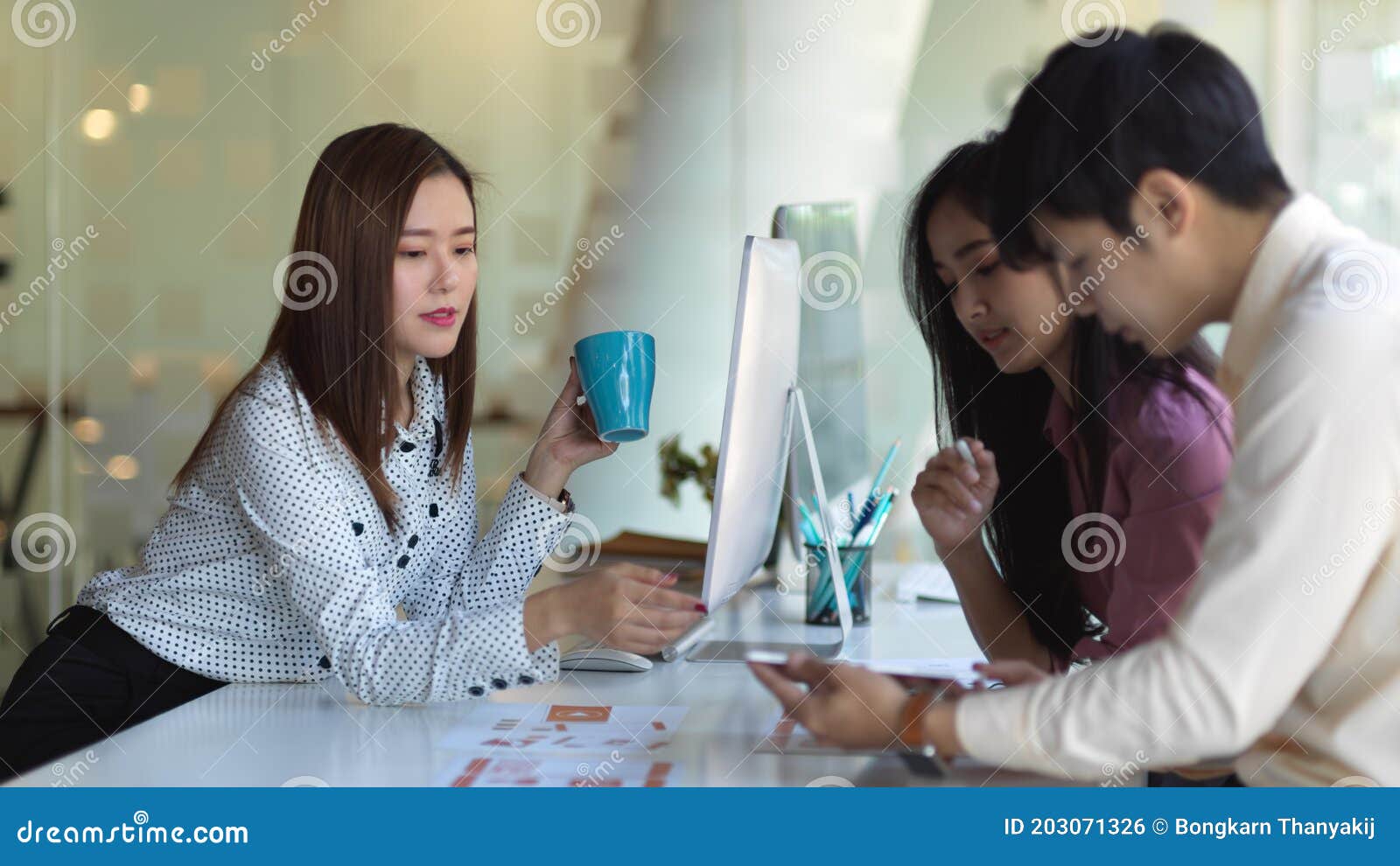 UI Developer Team Meeting on Their Project with Paperwork and Office ...