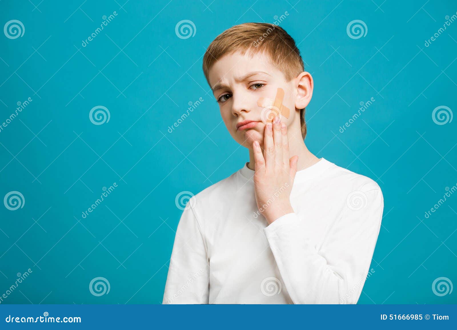 Portrait of Unhappy Boy with Adhesive Plaster on His Cheek Stock Image ...