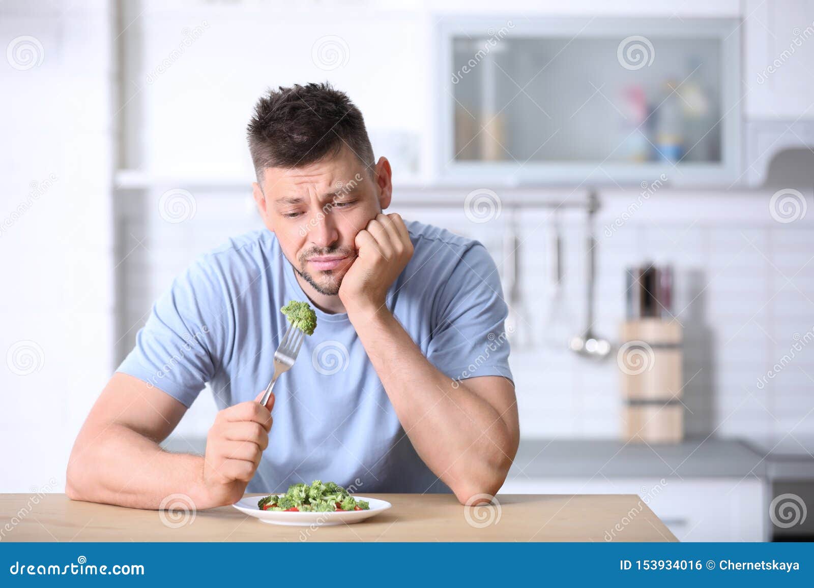 Portrait of Unhappy Man Eating Broccoli Salad Stock Photo - Image of ...
