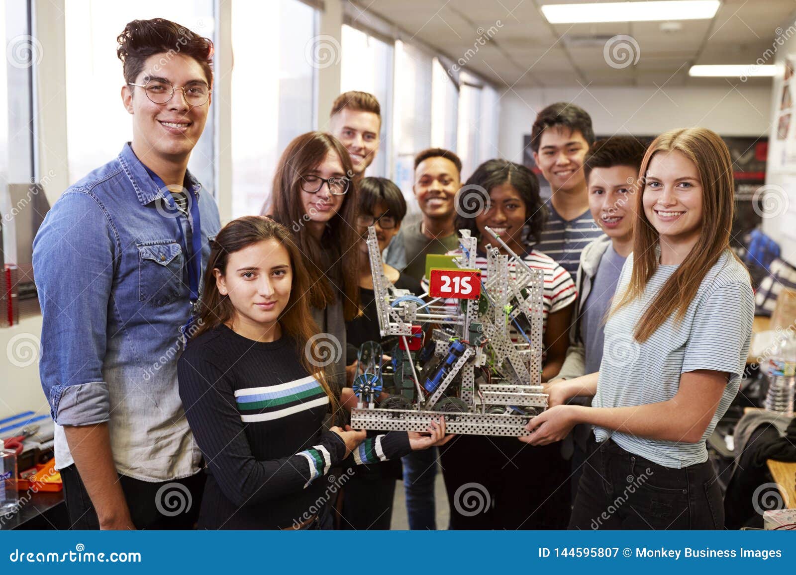 Portrait of University Students with Teacher Holding Machine in Science ...