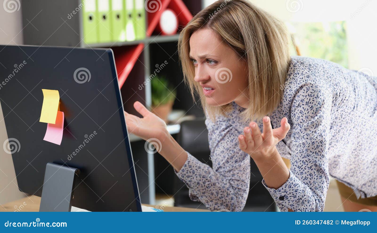 Upset Woman Looking at Laptop Screen with Angry Expression Stock Photo ...