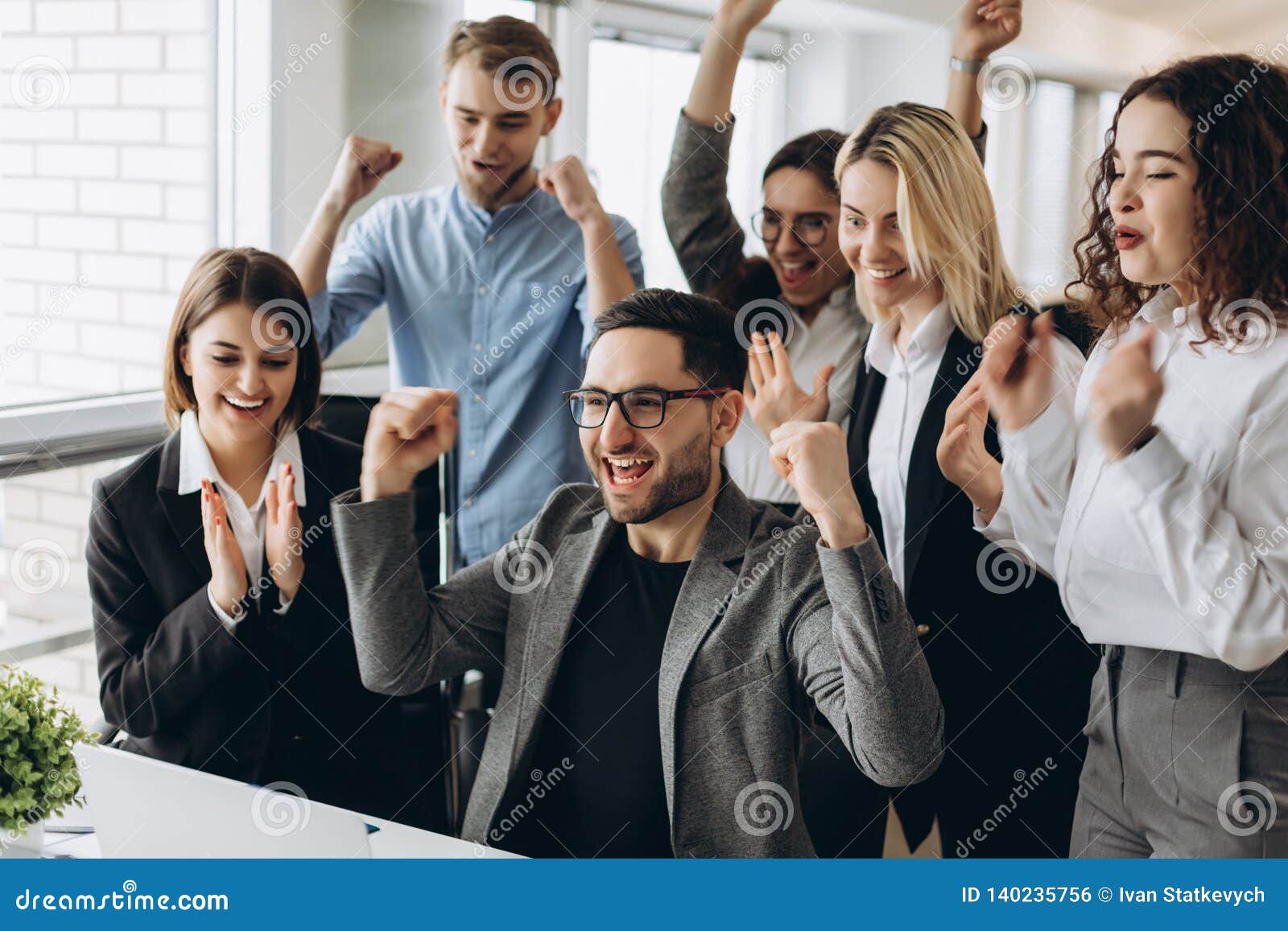 Portrait of Very Happy Successful Expressive Gesturing Business Team at ... Portrait of Very Happy Successful Expressive Gesturing Business Team at ...