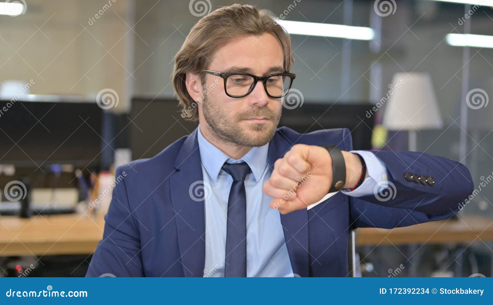 Portrait of Waiting Businessman Checking Time on Watch Stock Photo ...