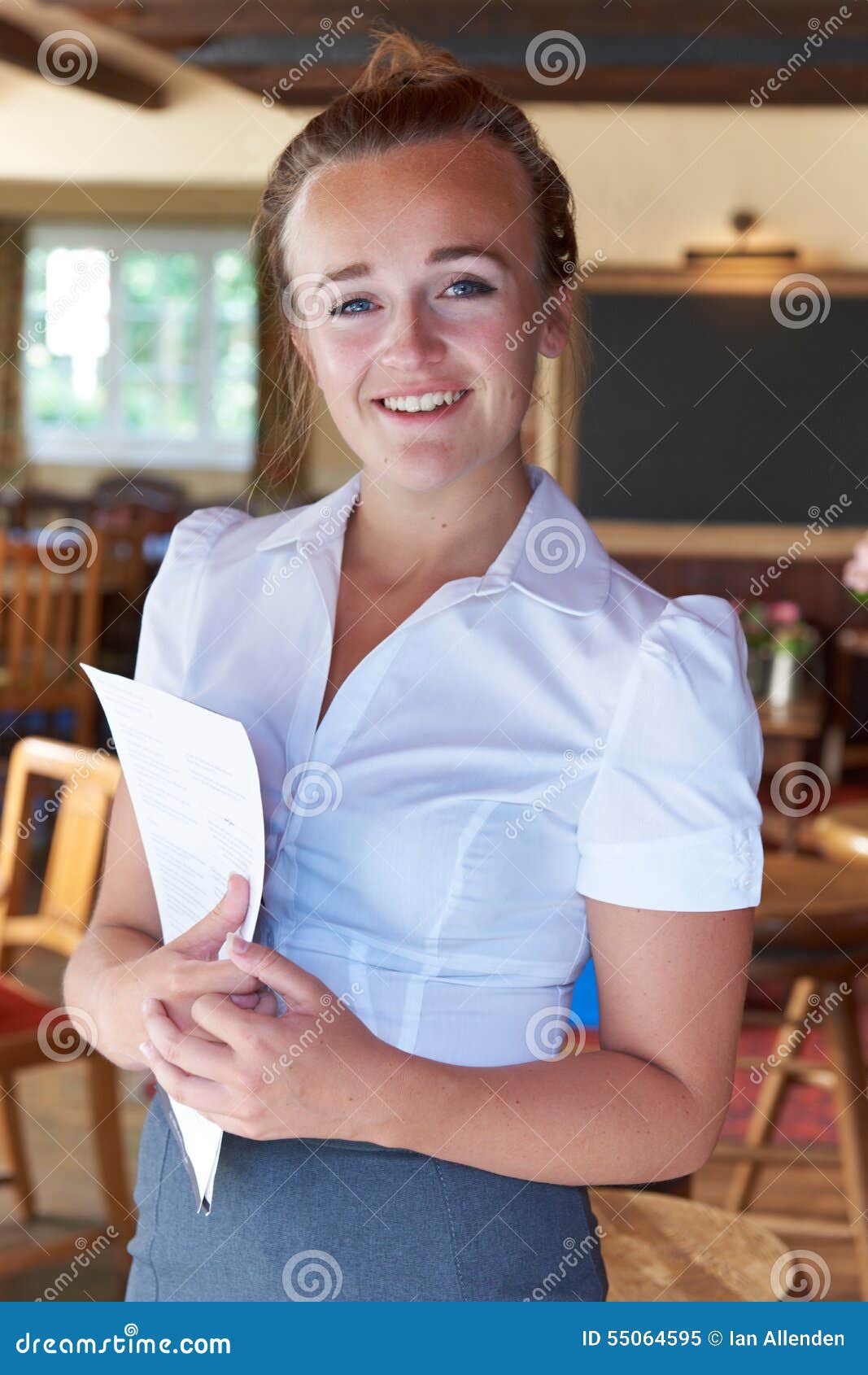Portrait of Waitress Holding Menu in Restaurant Stock Image - Image of ...