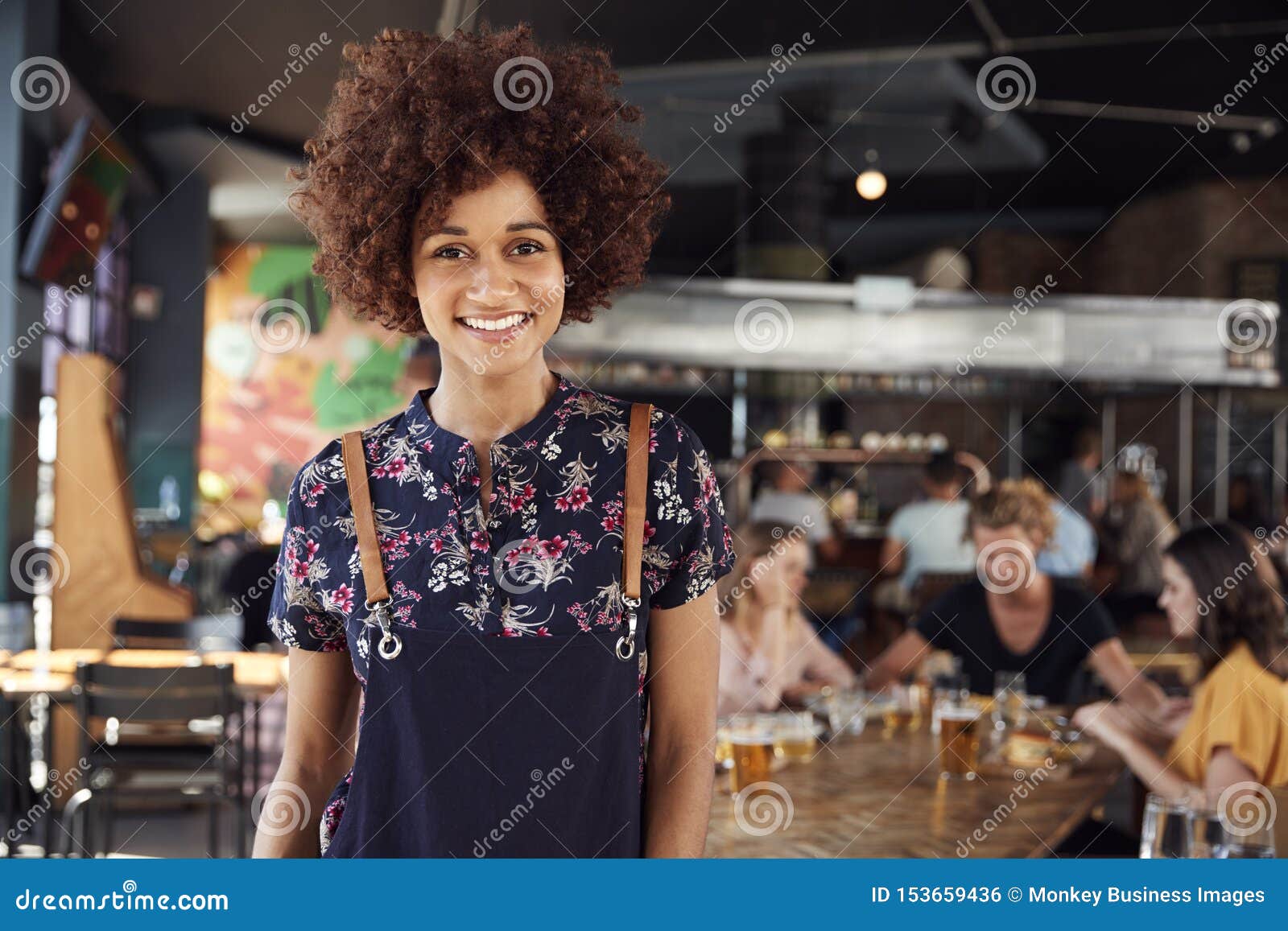 Portrait of Waitress Serving in Busy Bar Restaurant Stock Photo - Image ...