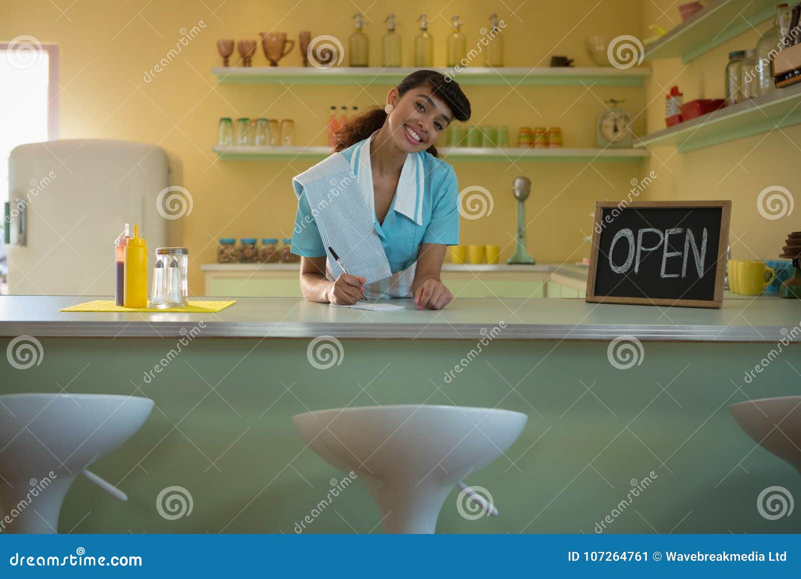 Waitress Standing at Counter in Restaurant Stock Image - Image of ...