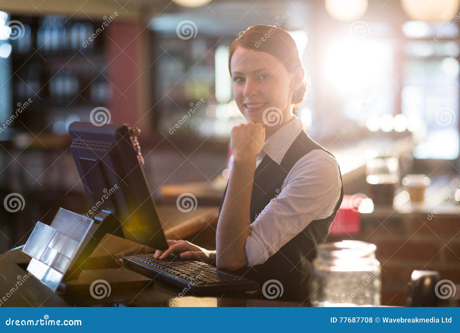 Portrait of Waitress Using a Computer at Counter Stock Photo - Image of ...
