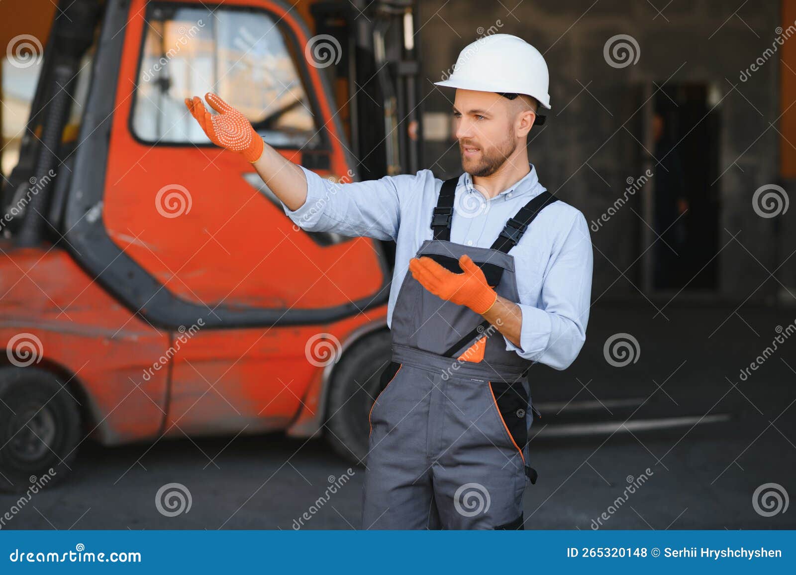 Portrait of Warehouse Forklift Driver Standing in Storehouse by the ...