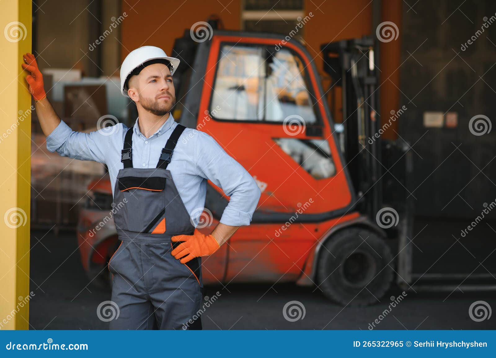 Portrait of Warehouse Forklift Driver Standing in Storehouse by the ...