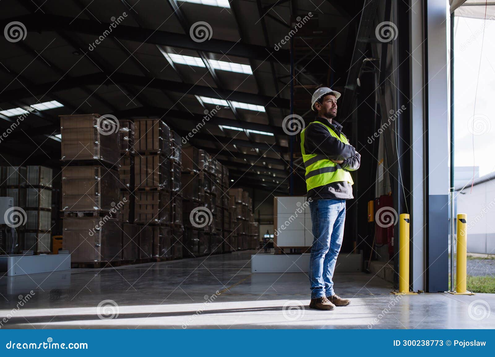 Portrait of Warehouse Worker Taking Break from Work, Standing and ...