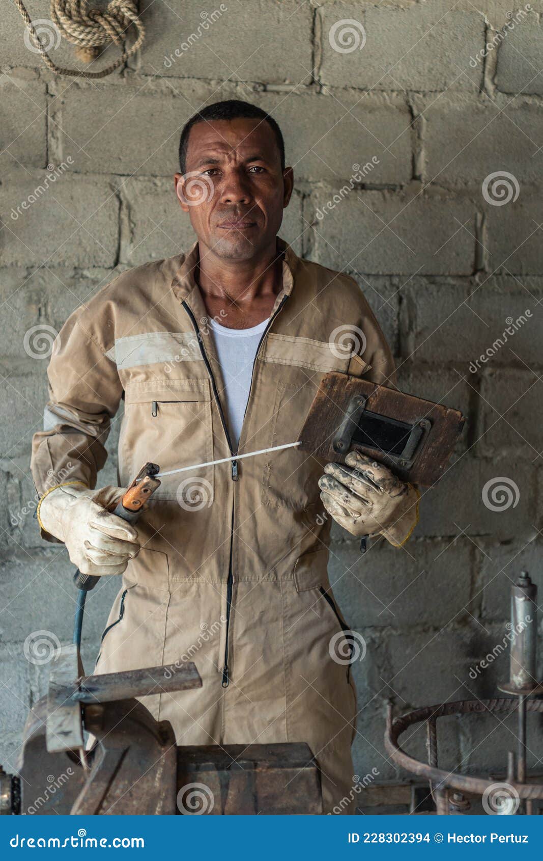 Portrait of a Welder with a Face Shield Standing in a Workshop Stock ...
