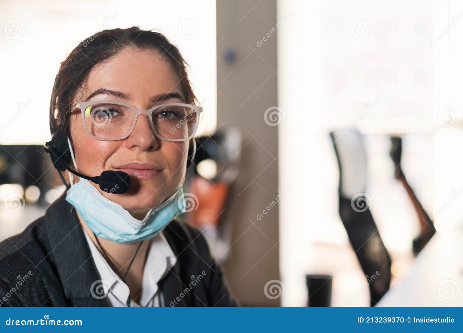 Portrait of a Woman Call Center Operator in a Lowered Mask Stock Photo ...
