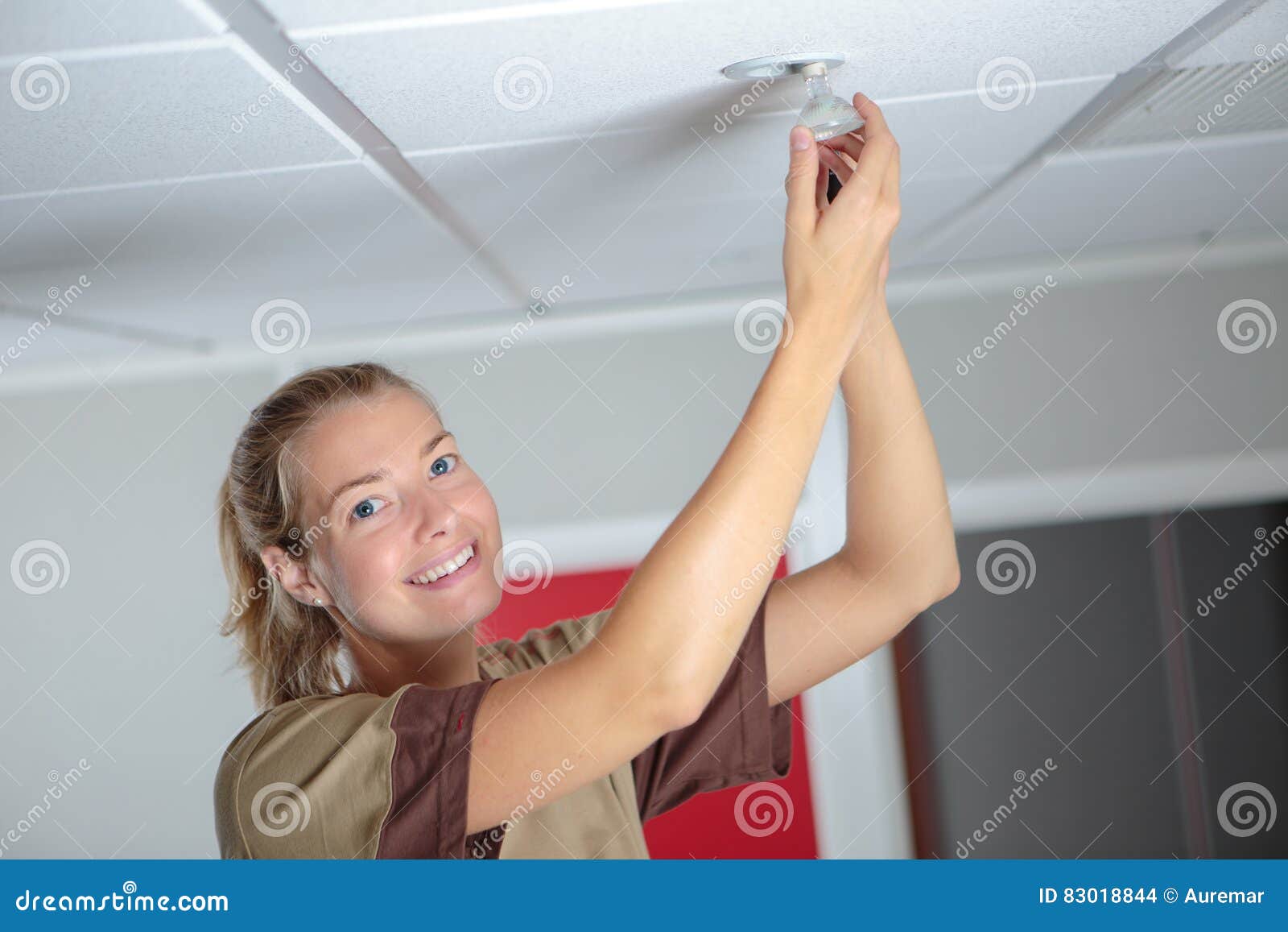 Portrait Woman Changing Lightbulb Stock Photo - Image of person ...