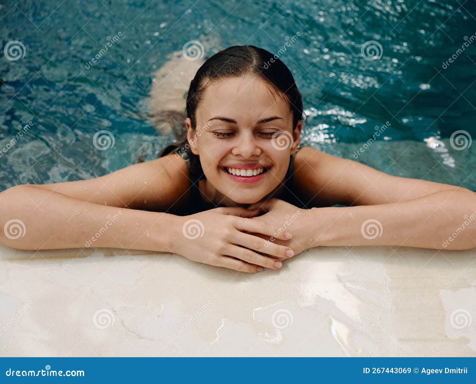 Portrait Of A Woman With Closed Eyes Swims In The Water In The Pool In
