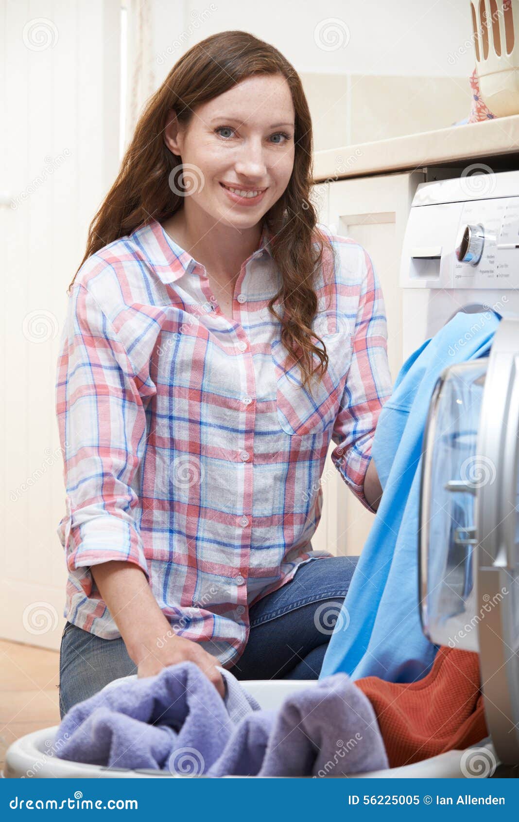 Portrait of Woman Doing Laundry at Home Stock Image - Image of happy ...