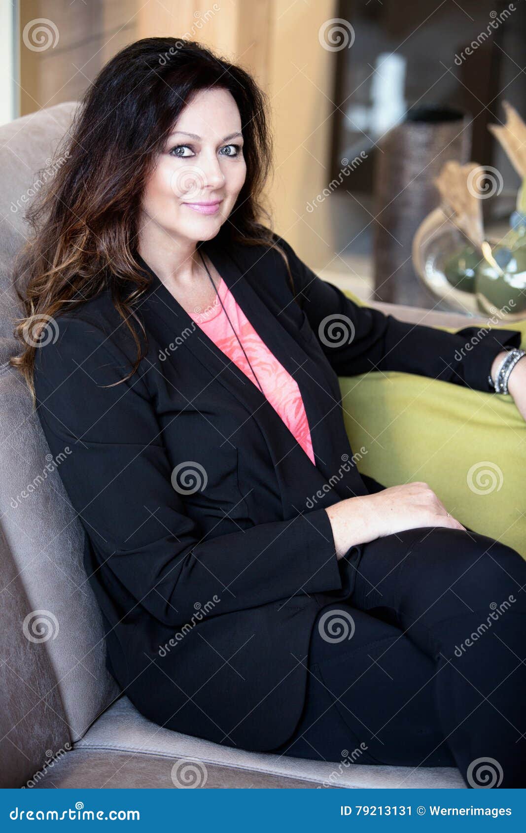 Portrait Of Woman In Her 40s Sitting On Couch Stock Image Image Of