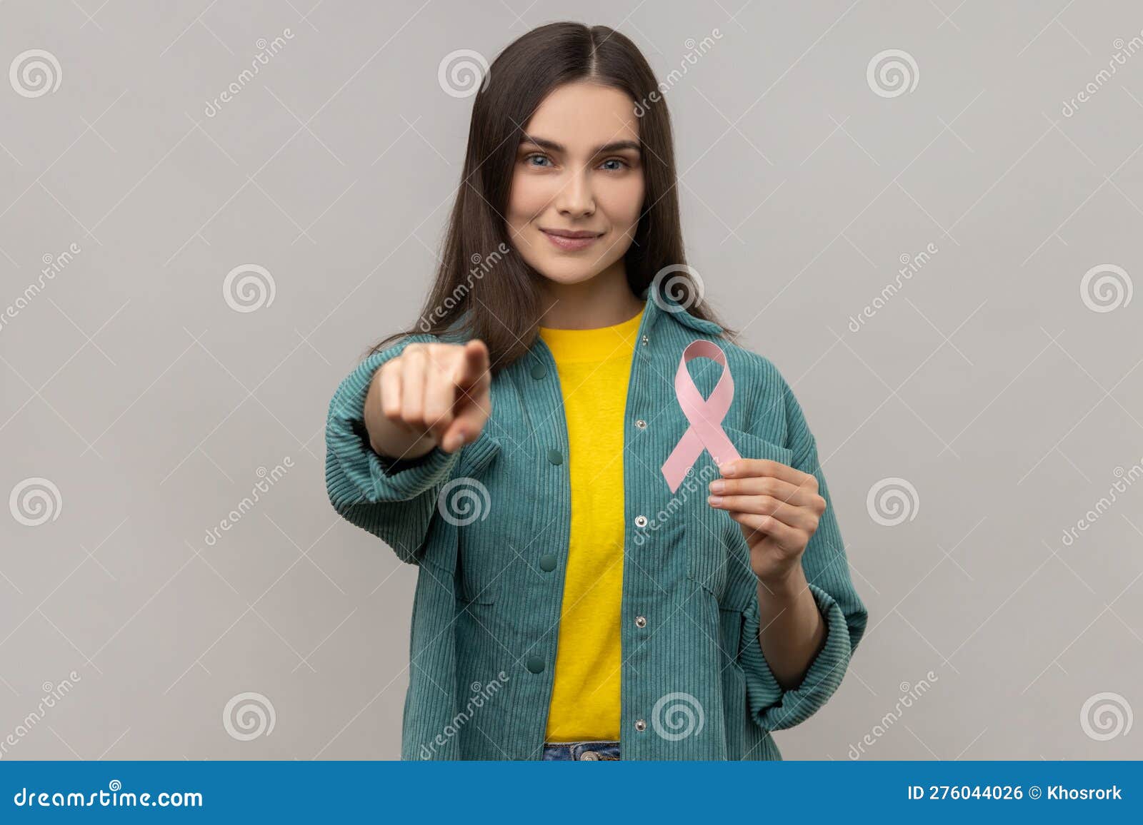 Woman Holding Pink Ribbon Symbol Of Breast Cancer Awareness Looking