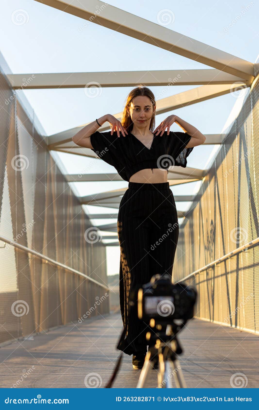 Portrait of Woman Modeling for a Camera Mounted on a Tripod, Woman on a ...