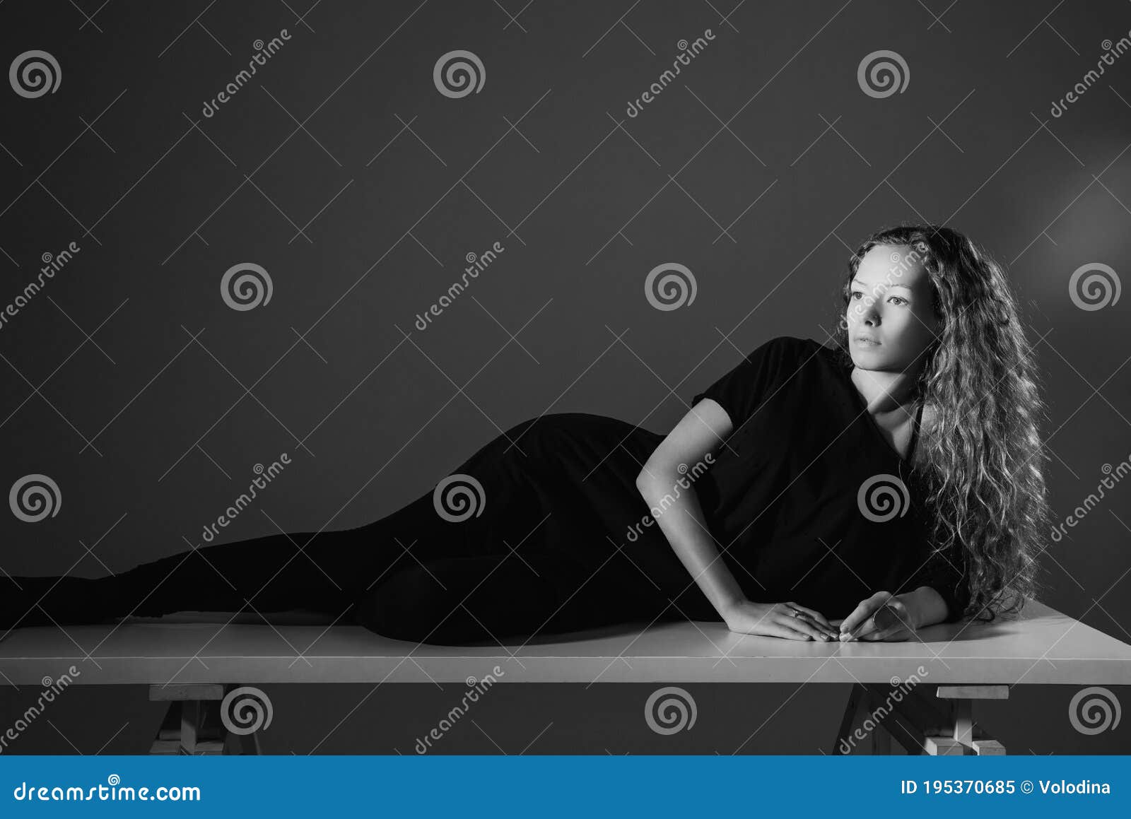 Woman Resting on a Table in a Photo Studio Stock Image - Image of ...