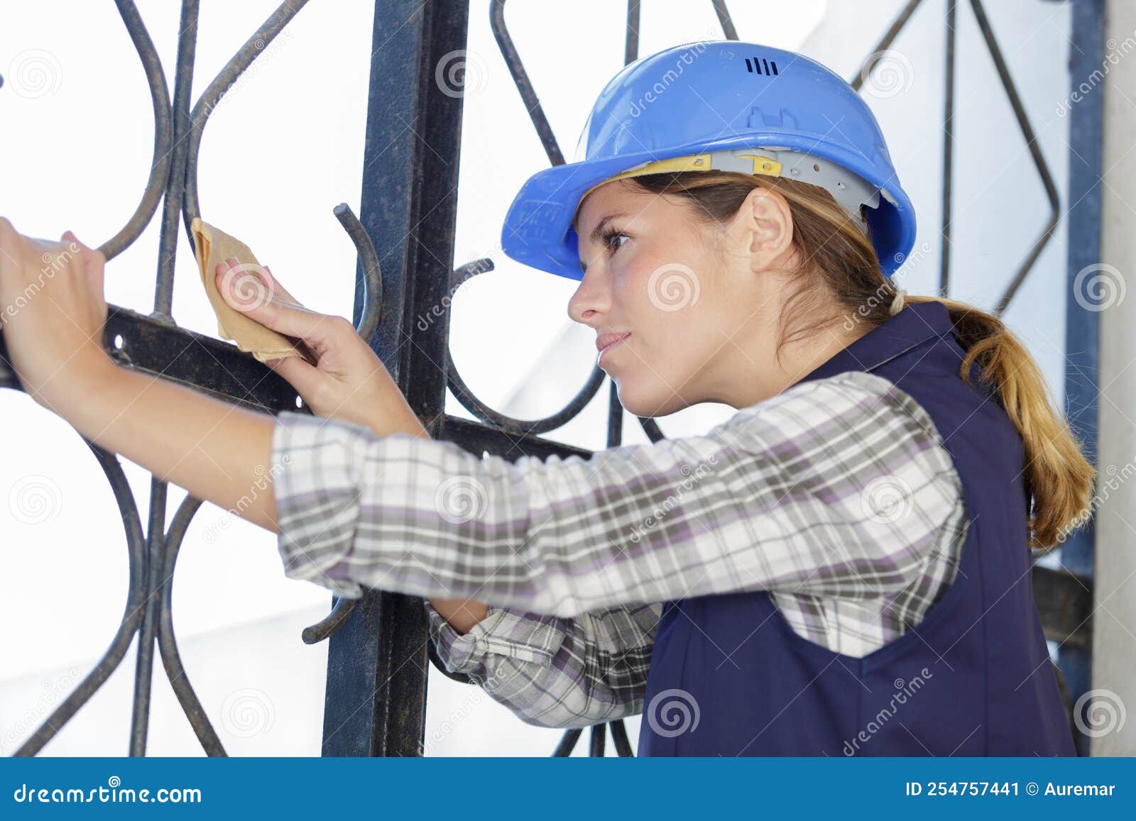 Portrait woman sanding stock image. Image of plasterer - 254757441