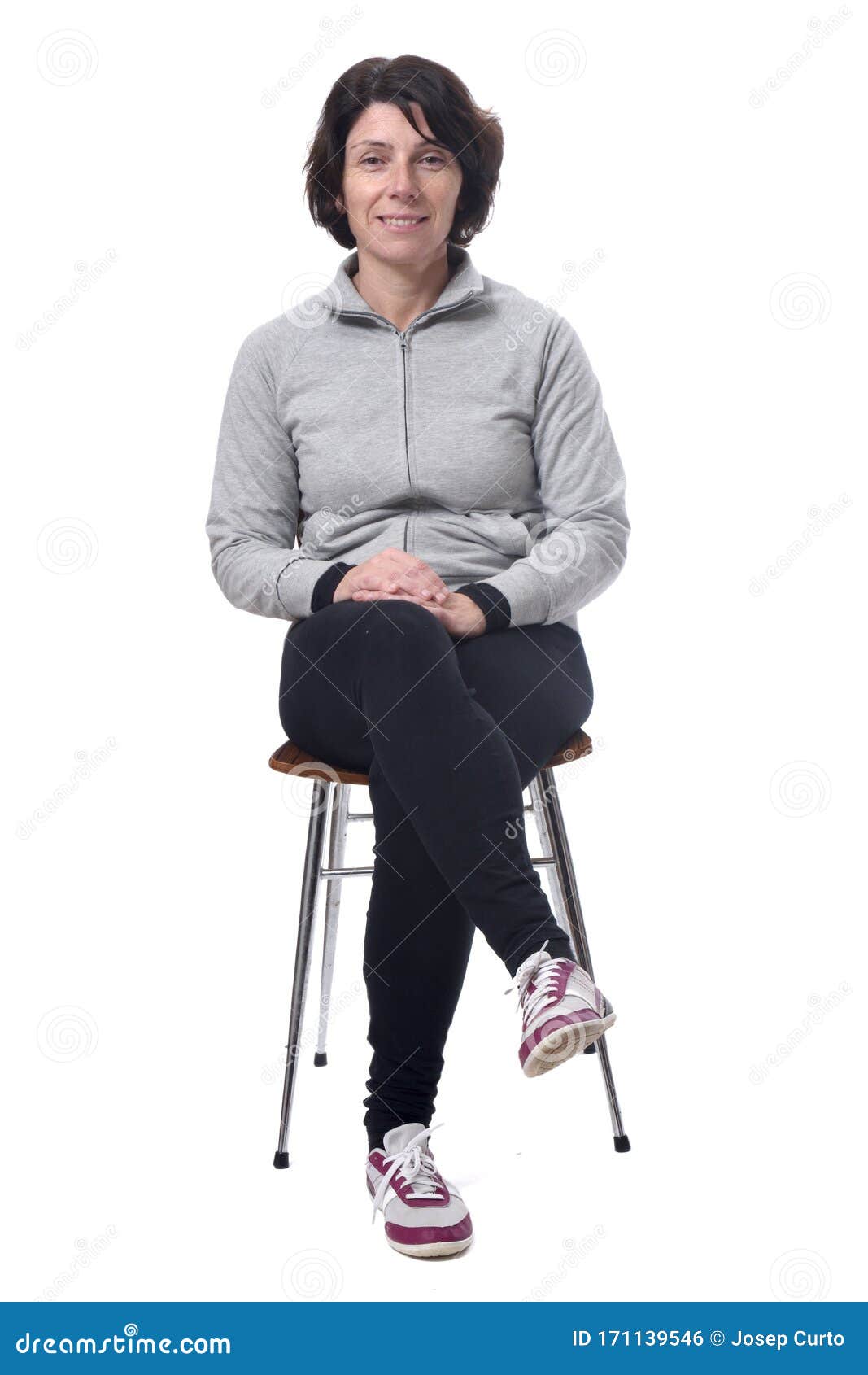 Portrait of a Woman Sitting on a Chair in White Background,legs Crossed ... Portrait of a Woman Sitting on a Chair in White Background,legs Crossed ...