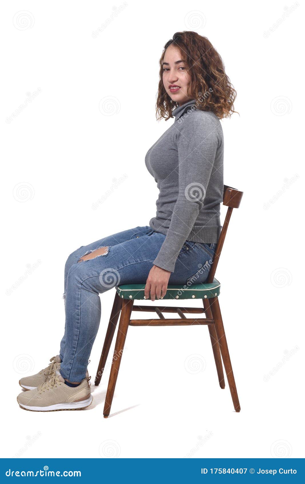 Portrait of a Woman Sitting on a Chair in White Background,looking at ... Portrait of a Woman Sitting on a Chair in White Background,looking at ...