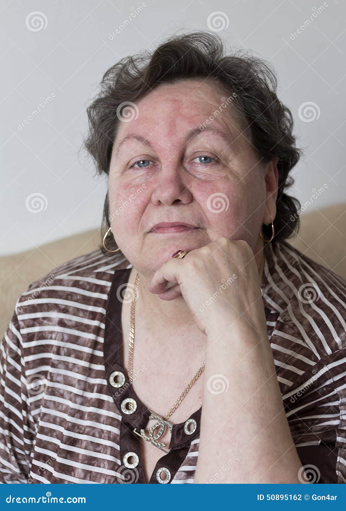 Portrait of a Woman Sitting at the Table,leaning on One Arm Stock Photo ...
