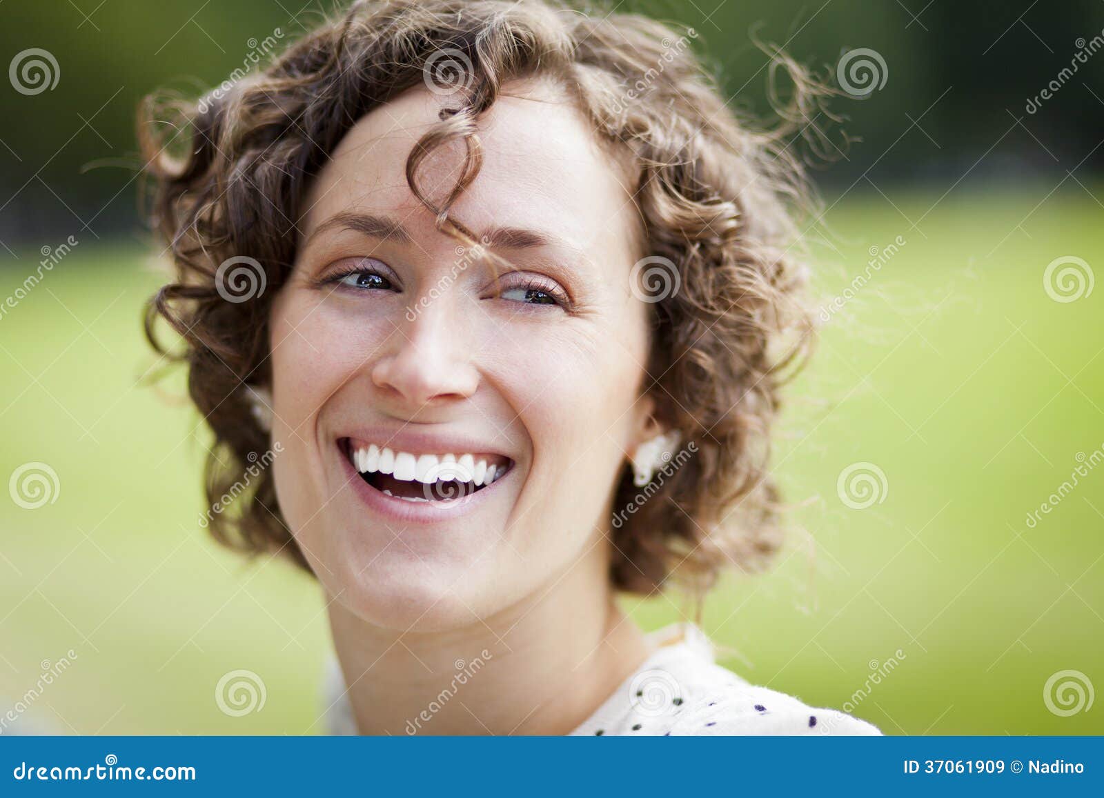 Portrait of a Woman Smiling Away Stock Image - Image of hair ...