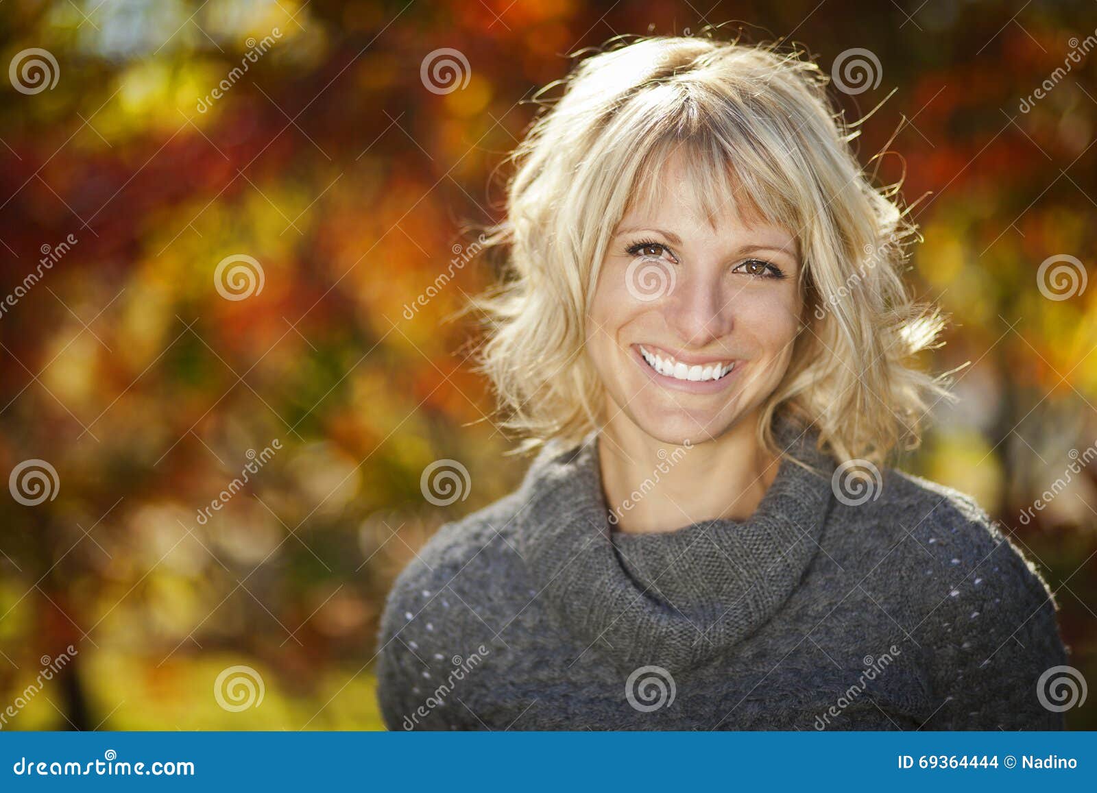 Portrait of a Woman Smiling at the Camera Stock Photo - Image of grass ...