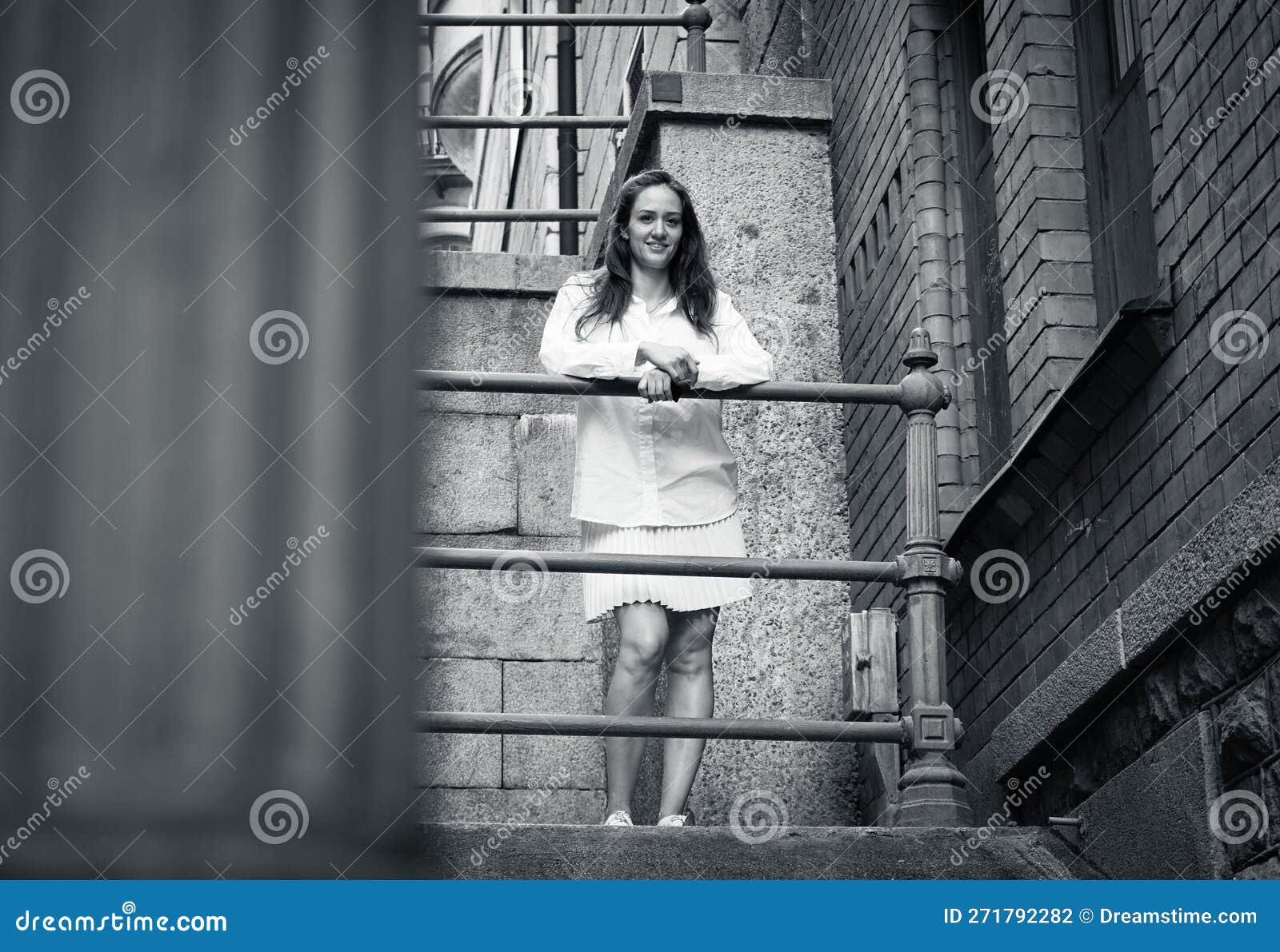 Portrait of a Woman Standing by Railing Stock Photo - Image of step ...