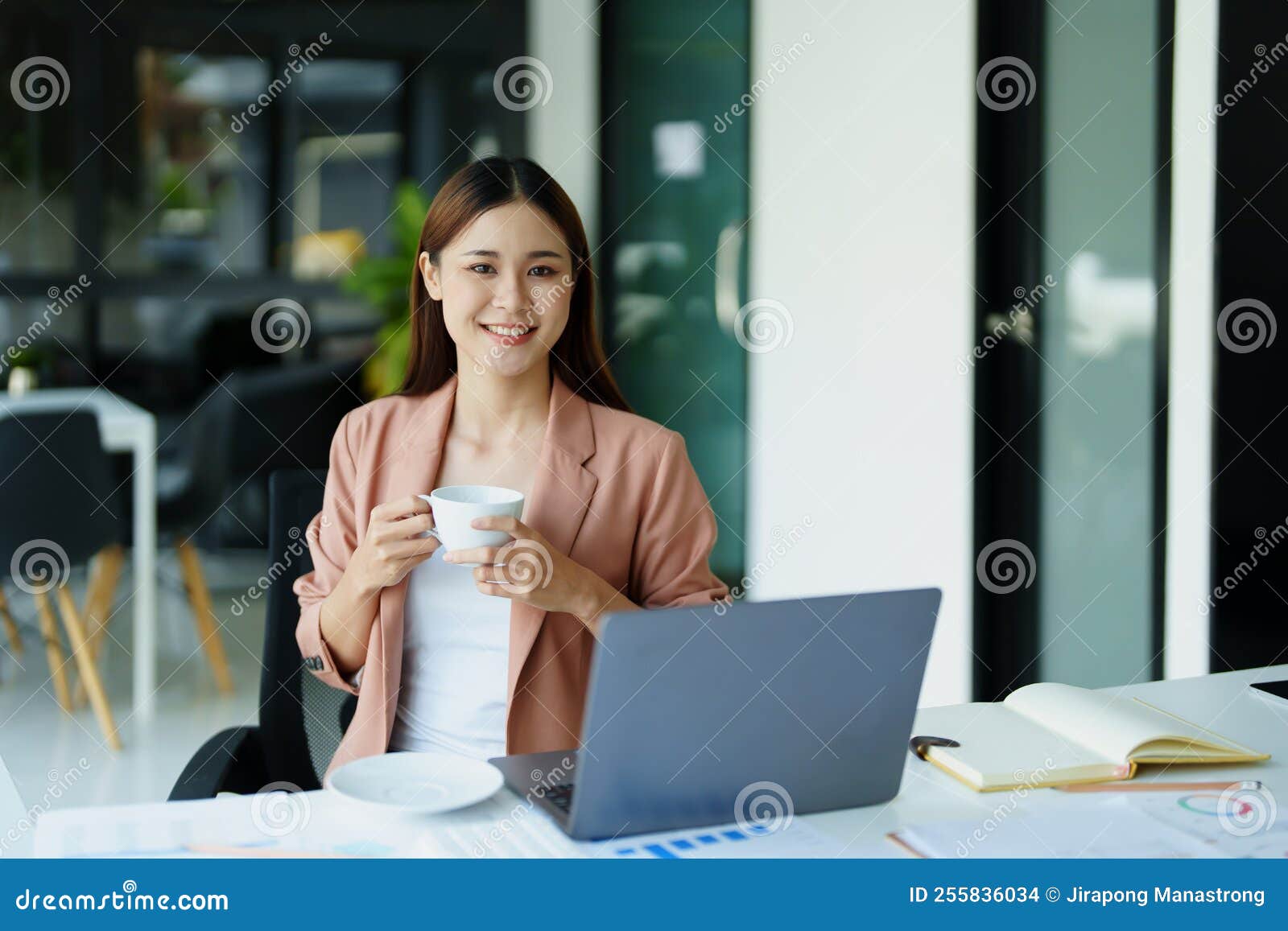Portrait of a Woman Taking a Coffee Break while Using a Computer. Stock ...